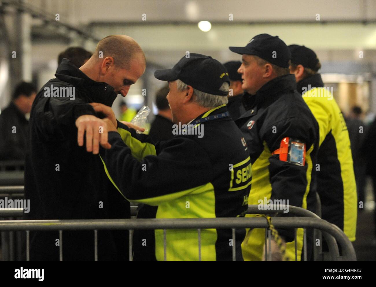 Fans are frisked by security before entering St James' Park Stock Photo ...