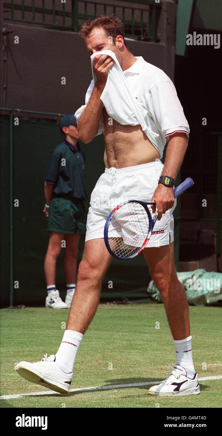 No Commercial Use. Britain's Greg Rusedski wipes his face during his ...