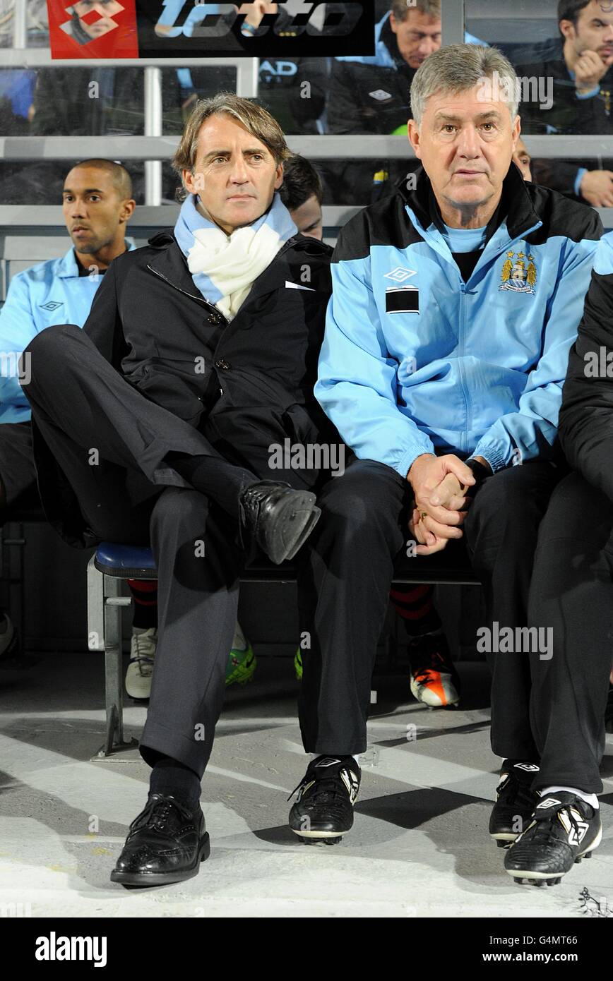 Manchester City manager Roberto Mancini (left) and his assistant Brian ...