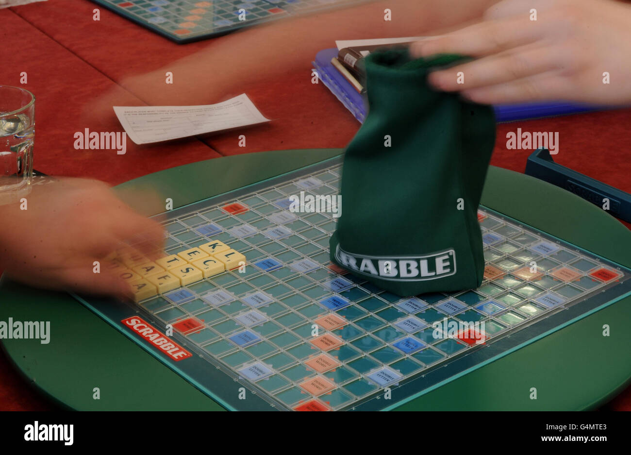 Play starts in the third game of the final of the National Scrabble ...