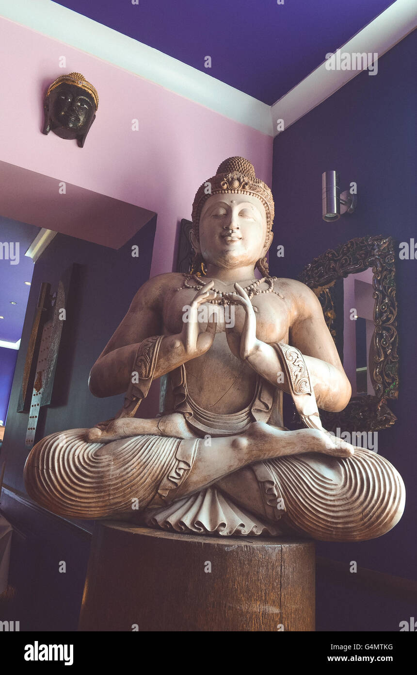 Buddha statue inside a house Stock Photo - Alamy