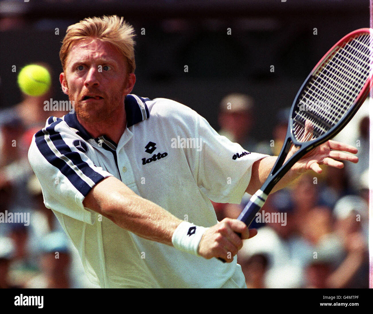 No commercial use. Germany's Boris Becker watches the ball closely ...