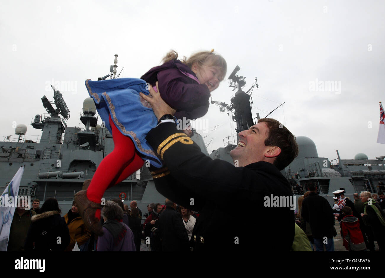 LT Gregg Seaman holds his daughter Eliza following the return of HMS ...