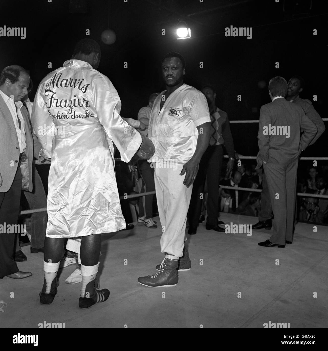 Marvis Frazier, left back to camera, with his father, former ...
