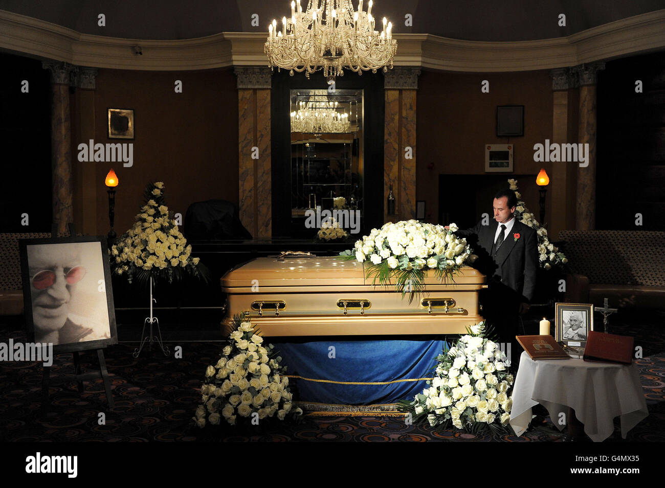 Robert Morphet stands next to the golden coffin of Sir Jimmy Savile ...