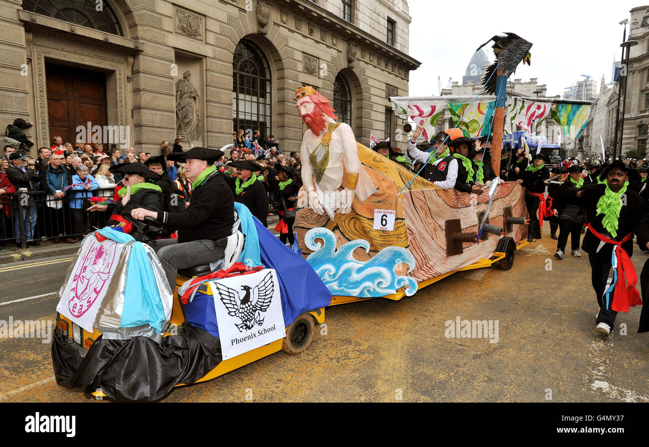 One of the many colourful floats on display, passes the Mansion House ...