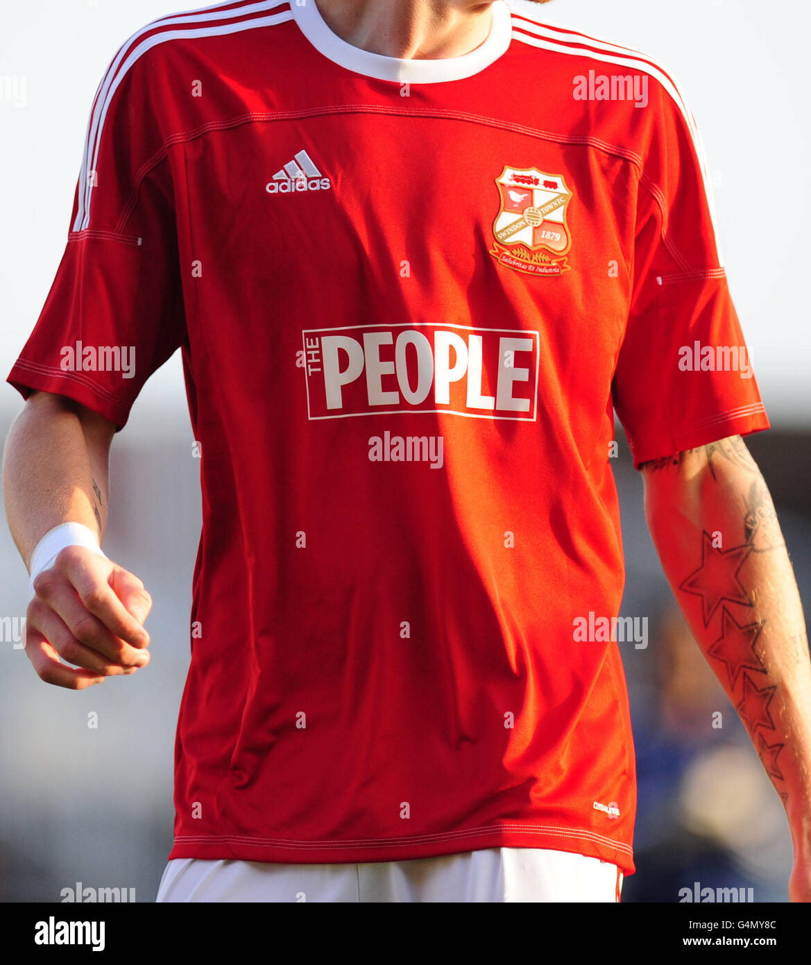 The People newspaper shirt sponsor on the Swindon Town FA Cup kit Stock ...