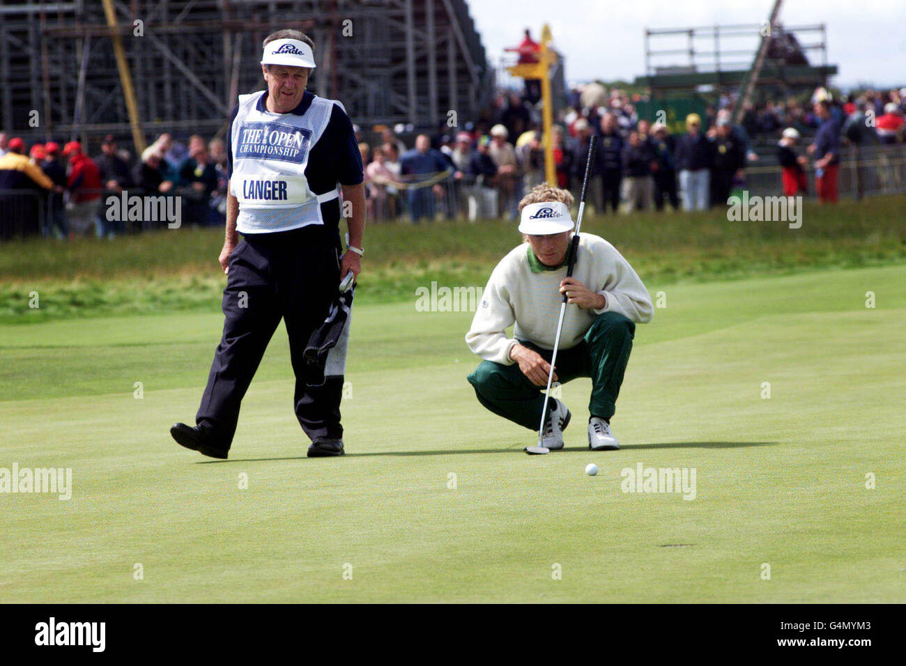Germany's Bernhard Langer studies the lie of the 18th green, on the ...