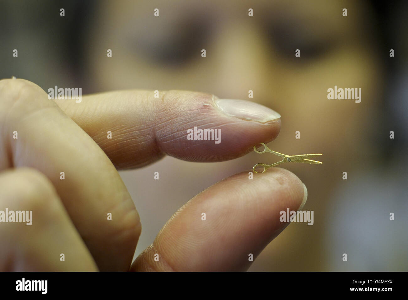 A tiny pair of all brass and fully working hinged scissors. PRESS ...
