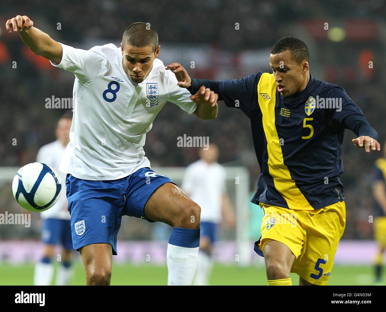 Sweden's Martin Olsson (right) and England's Jack Rodwell (left) battle ...