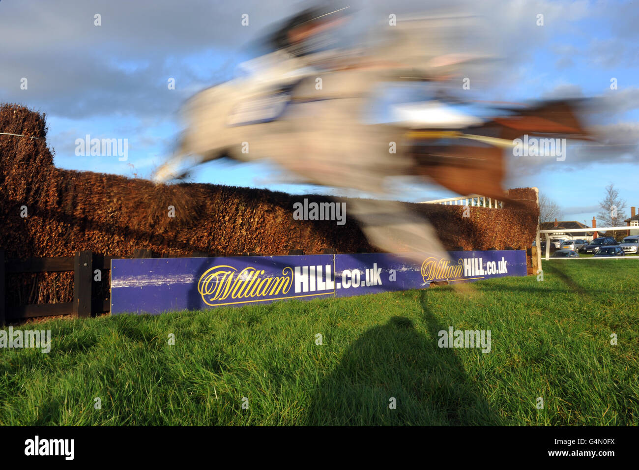 Runners and riders race over the fences during the Colin Parker ...