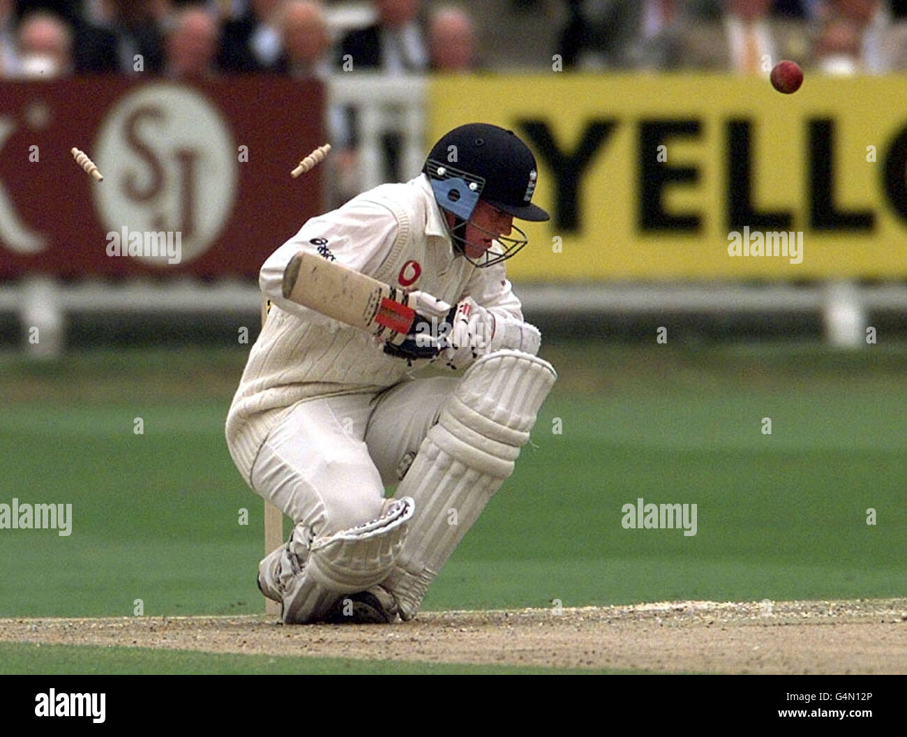 England's Chris Read is bowled by New Zealand's Chris Cairns for nought ...