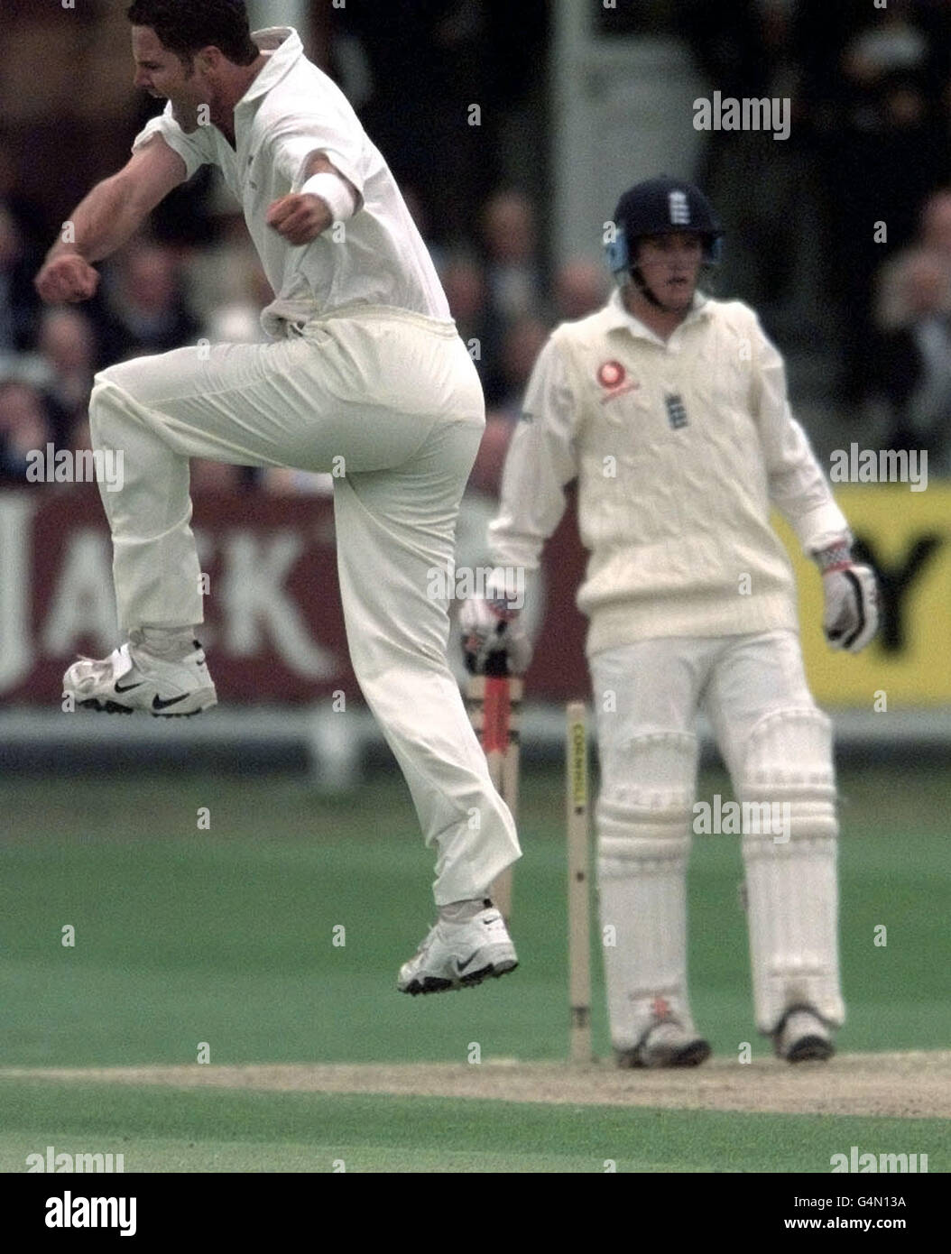 New Zealand bowler Chris Cairns, leaps to celebrate the dismissal of ...