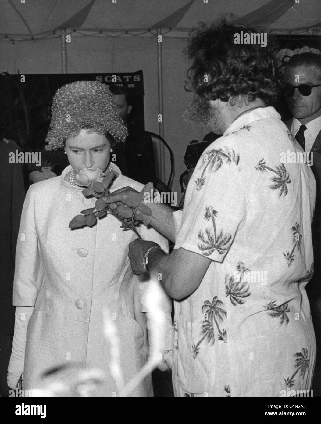 Queen Elizabeth II smells a rose from rose expert Harry Wheatcroft when ...