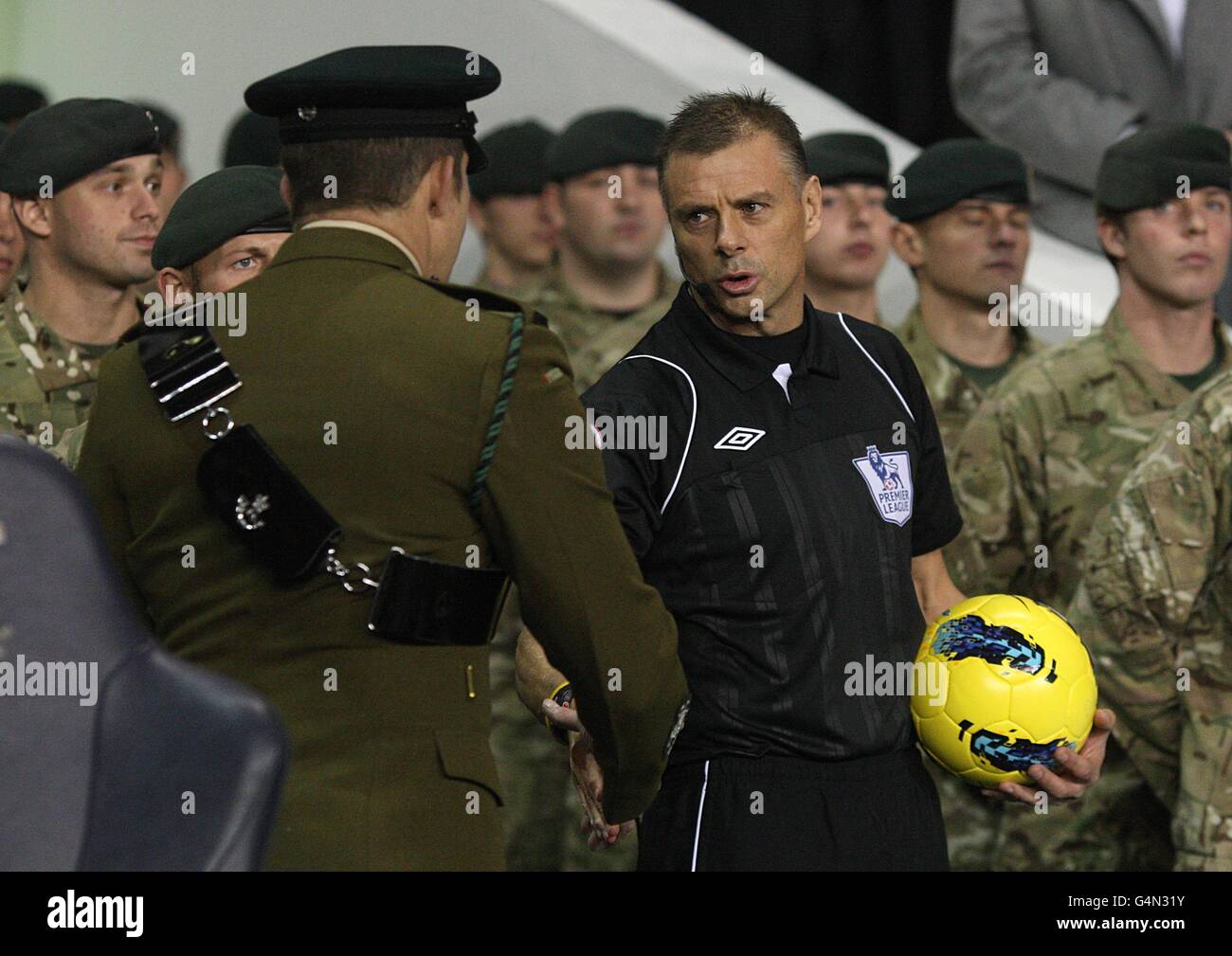 Referee Mark Halsey (centre) shakes hands with Regimental Sergeant ...