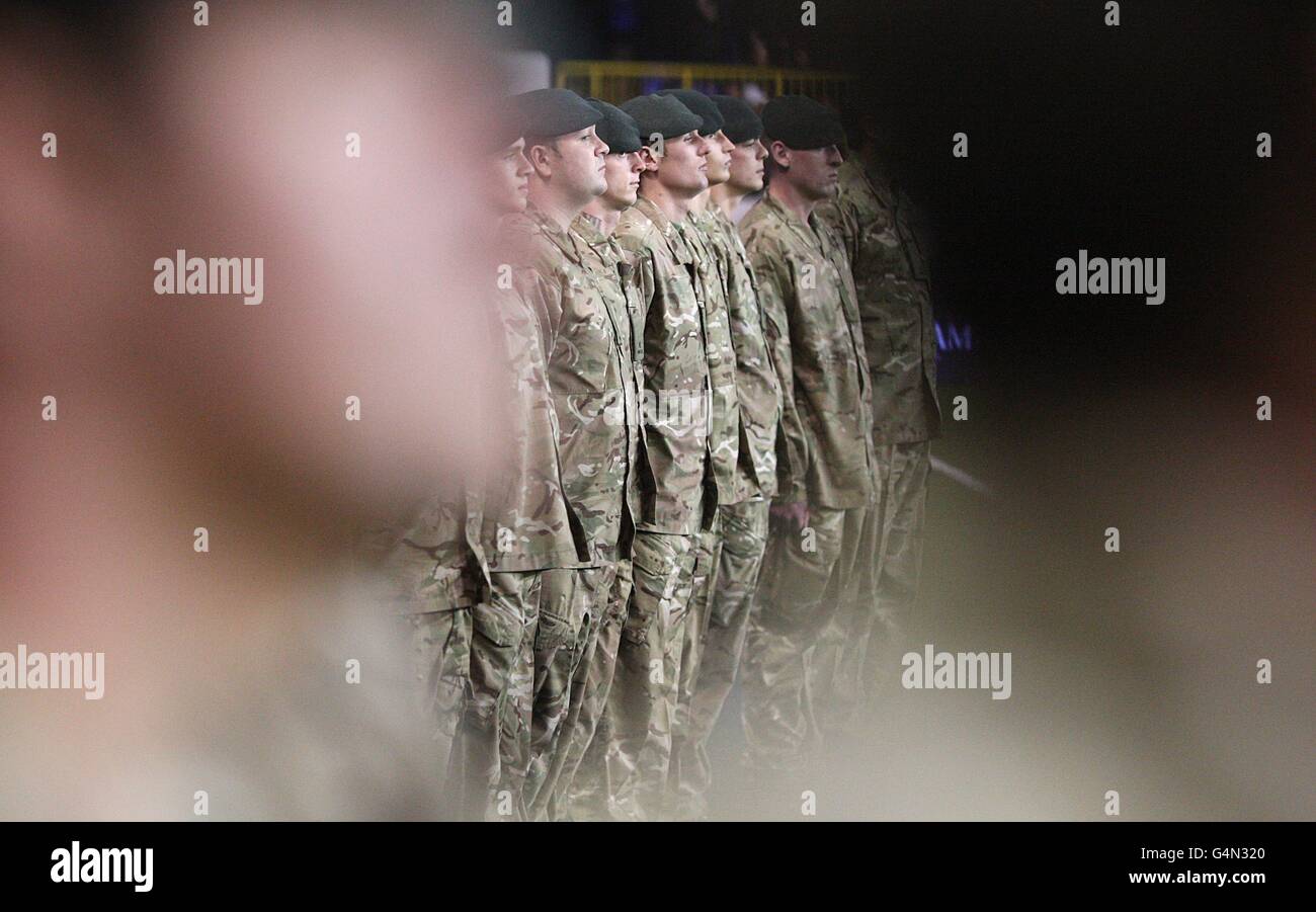1st and 4th Battalions of the Rifles regiment stand on the pitch prior ...
