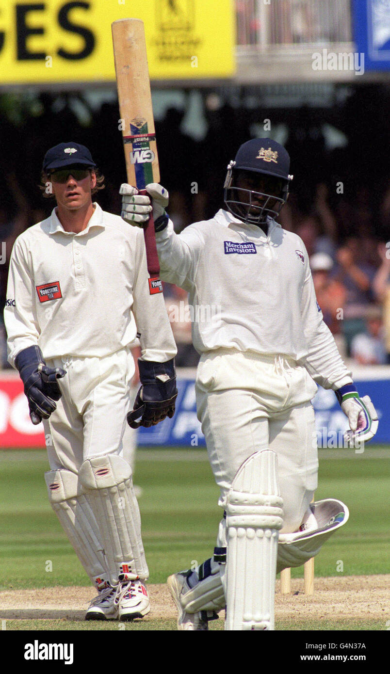 Gloucestershire's Mark Alleyne salutes the crowd after getting a ...