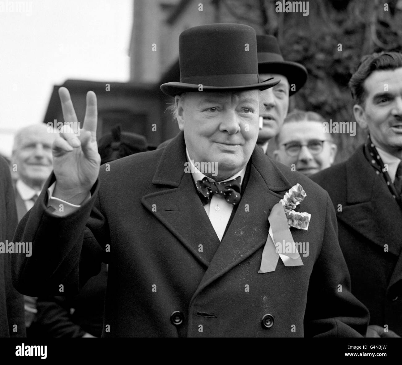 Winston Churchill give his 'victory' sign as he made a general election ...