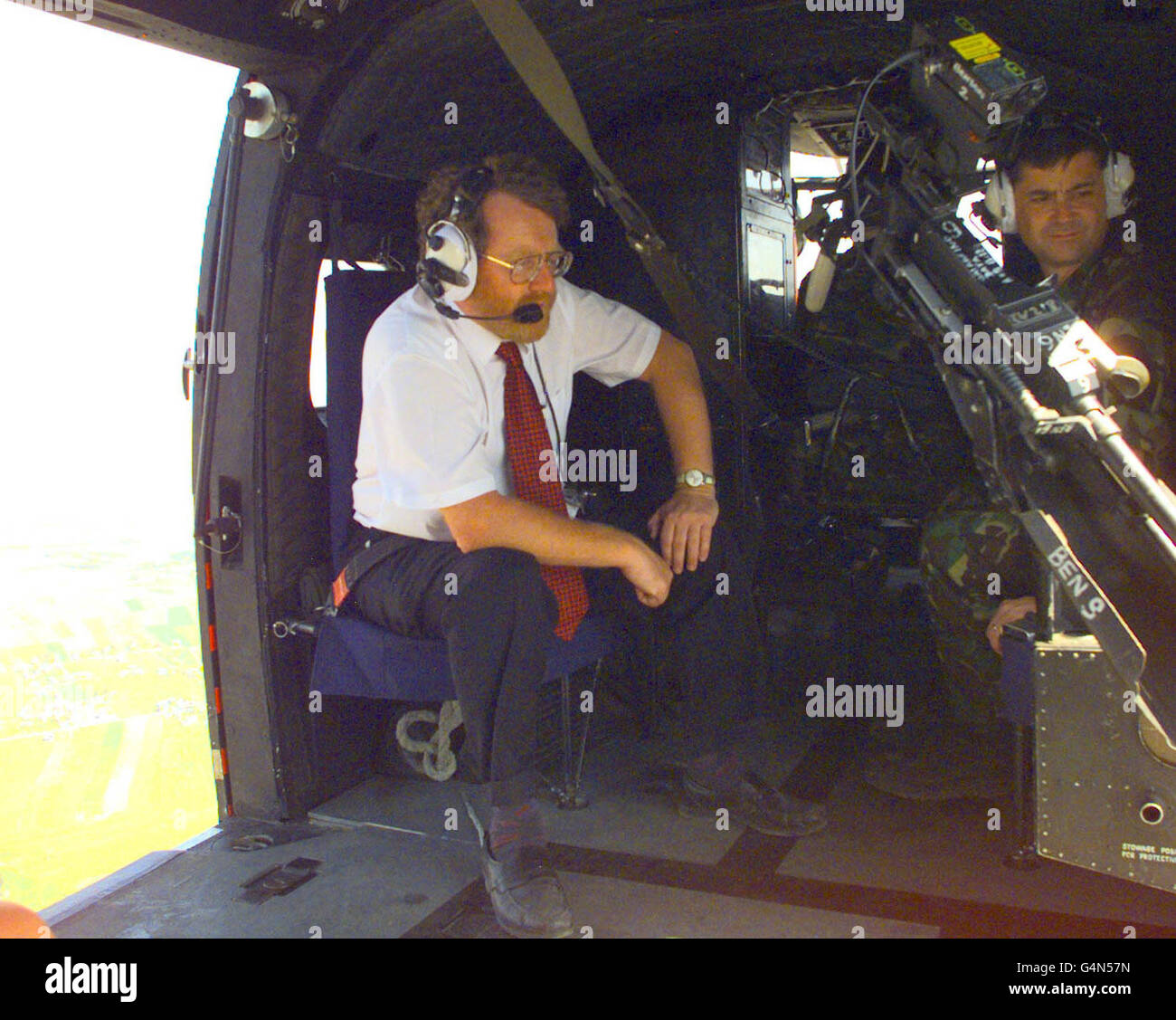 Britain's Armed Forces Minister John Spellar looks over the damage in ...
