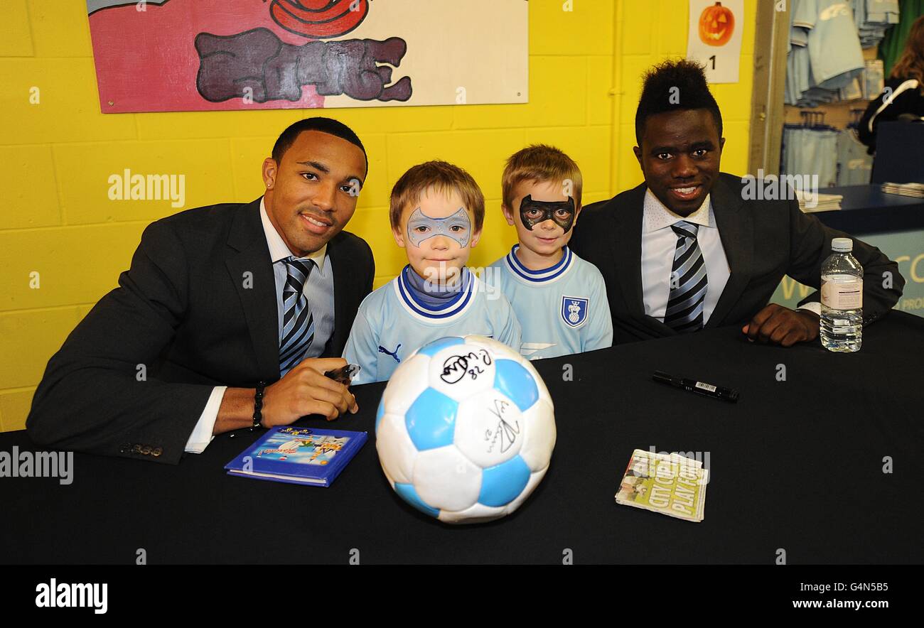 Coventry City's Callum Wilson (left) and Gael Bigirimana pose for ...