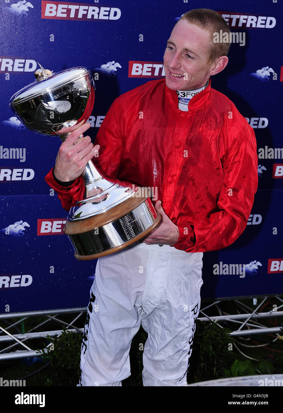 Champion Jockey Paul Hanagan with the Championship Trophy following the ...