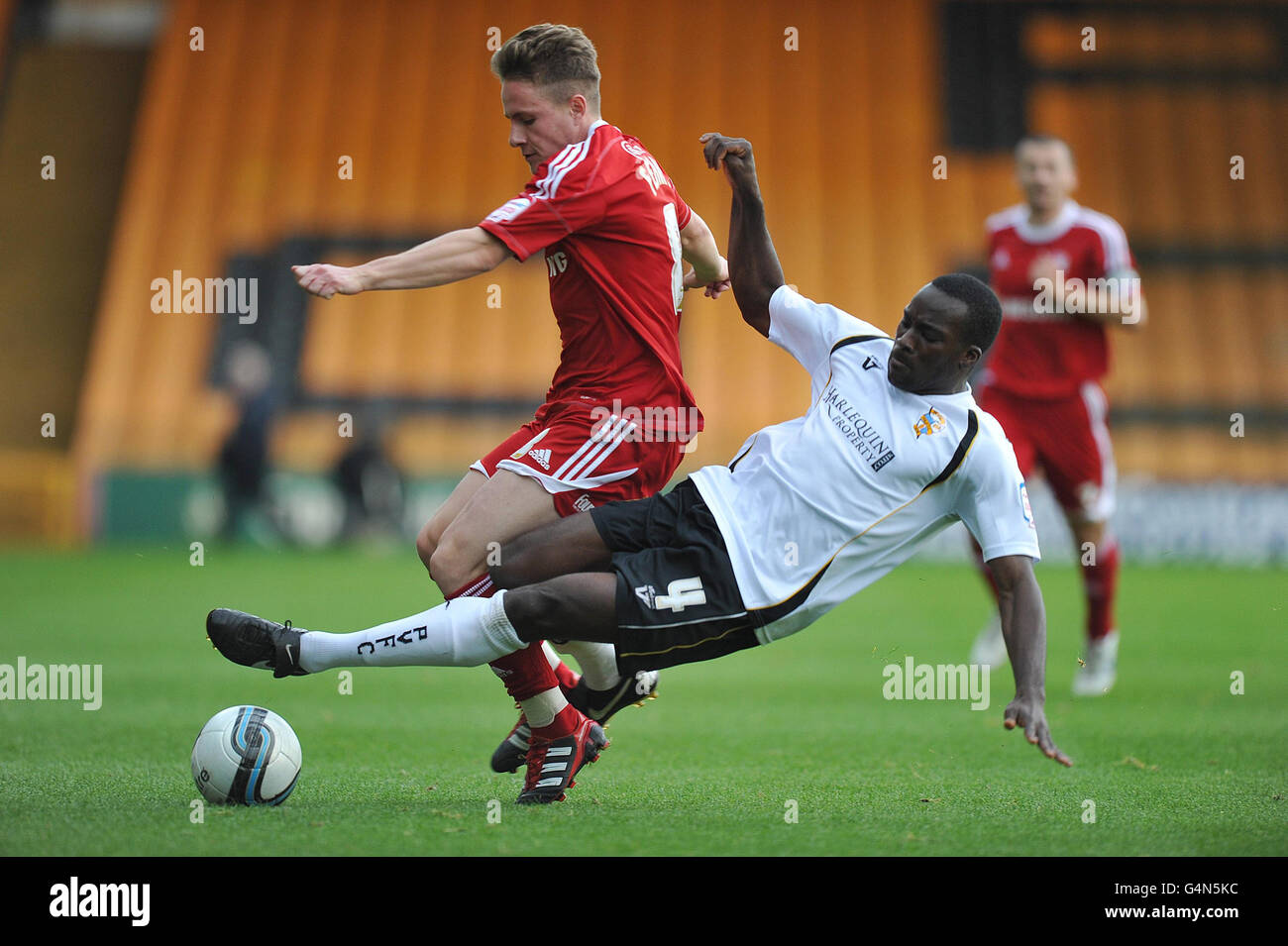 Port Vale's Anthony Griffith tackles Swindon Town's Simon Ferry during ...