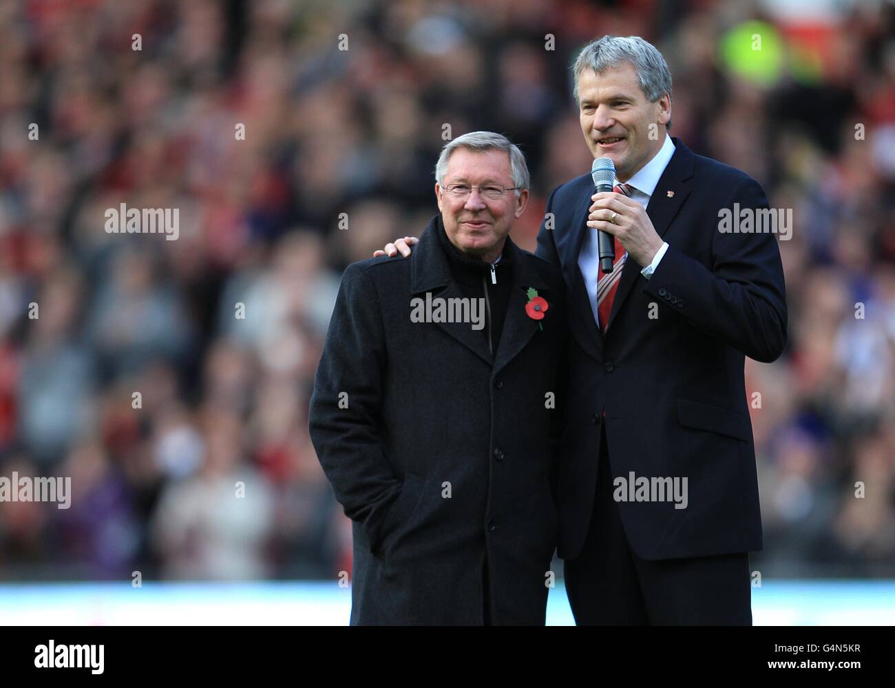 Manchester United manager Sir Alex Ferguson stands with Chief Executive ...