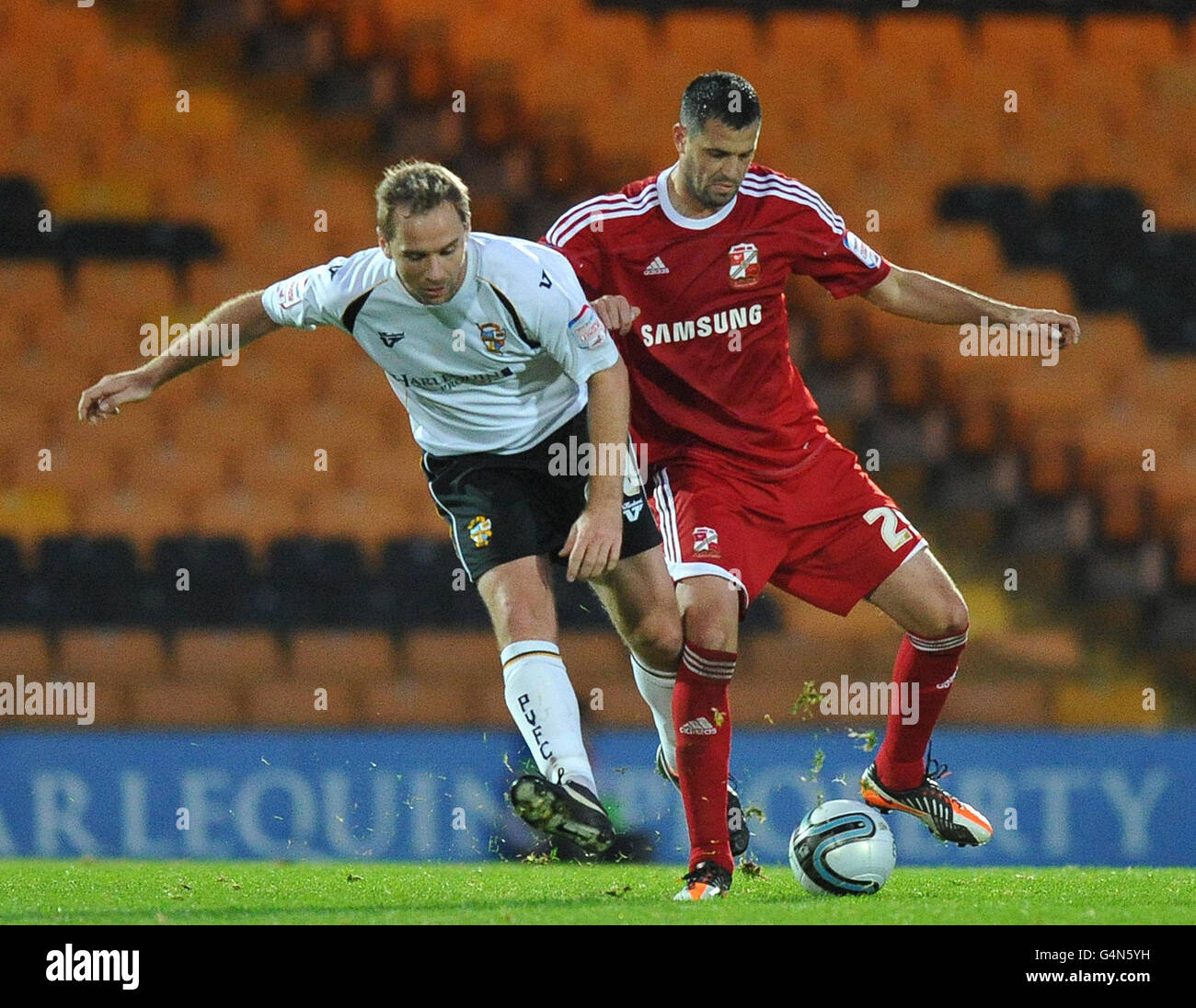 Port Vale's Liam Chilvers and Swindon Town's Lukas Magera battle for ...