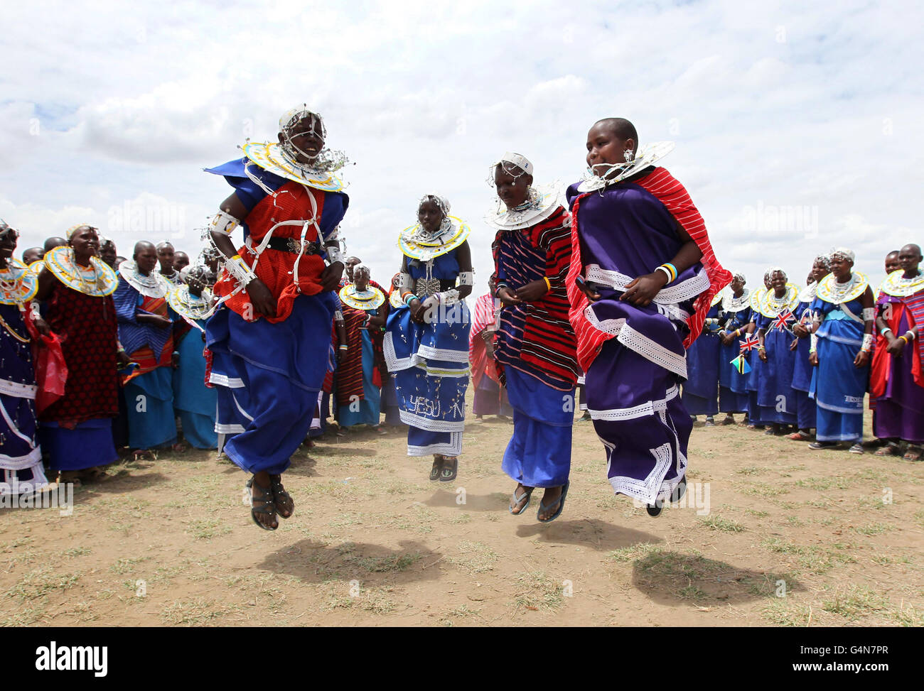 Massai women dance during a visit by The Prince of Wales and the ...
