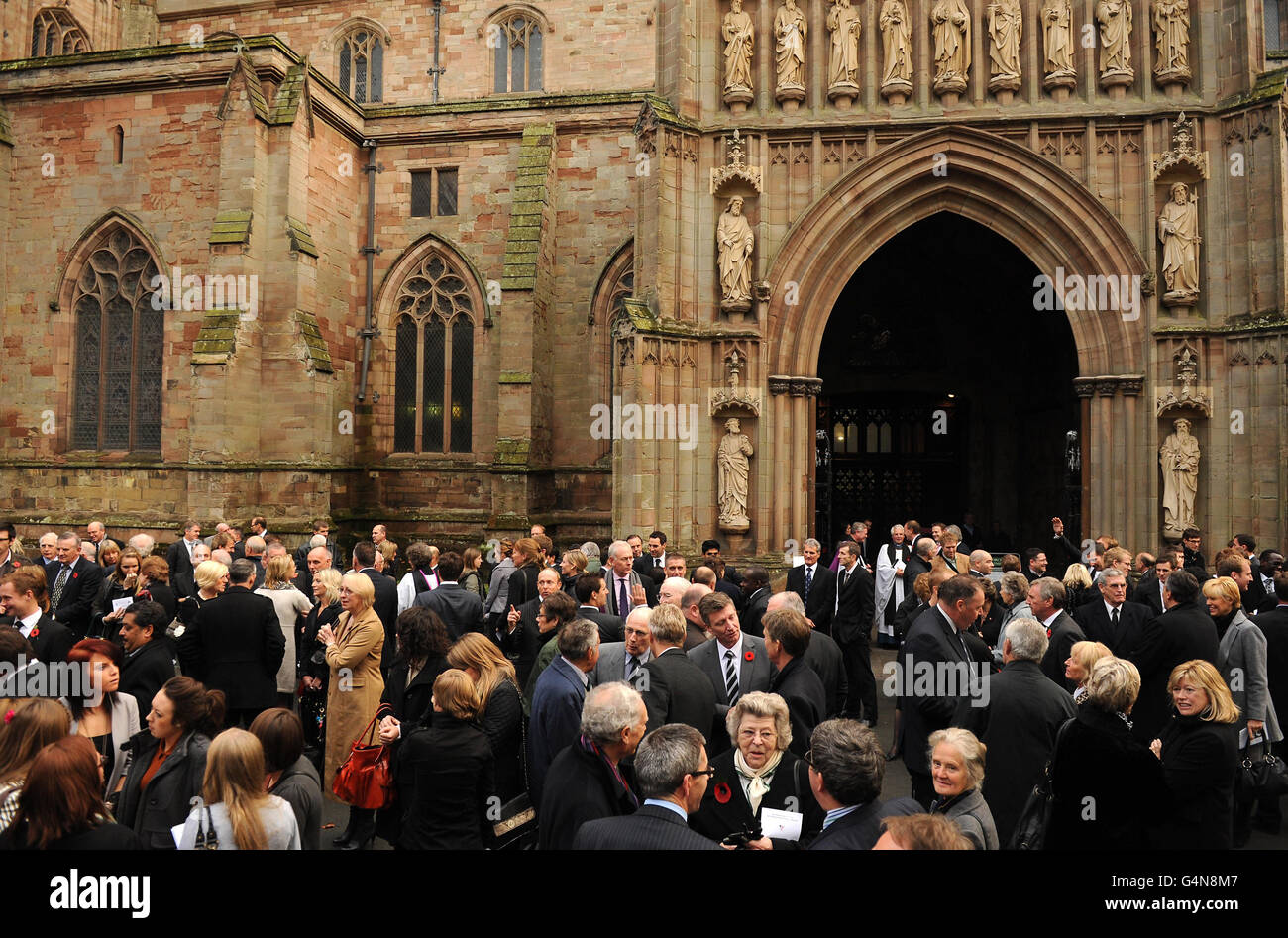 Memorial guests congregate following the thanksgiving service for ...