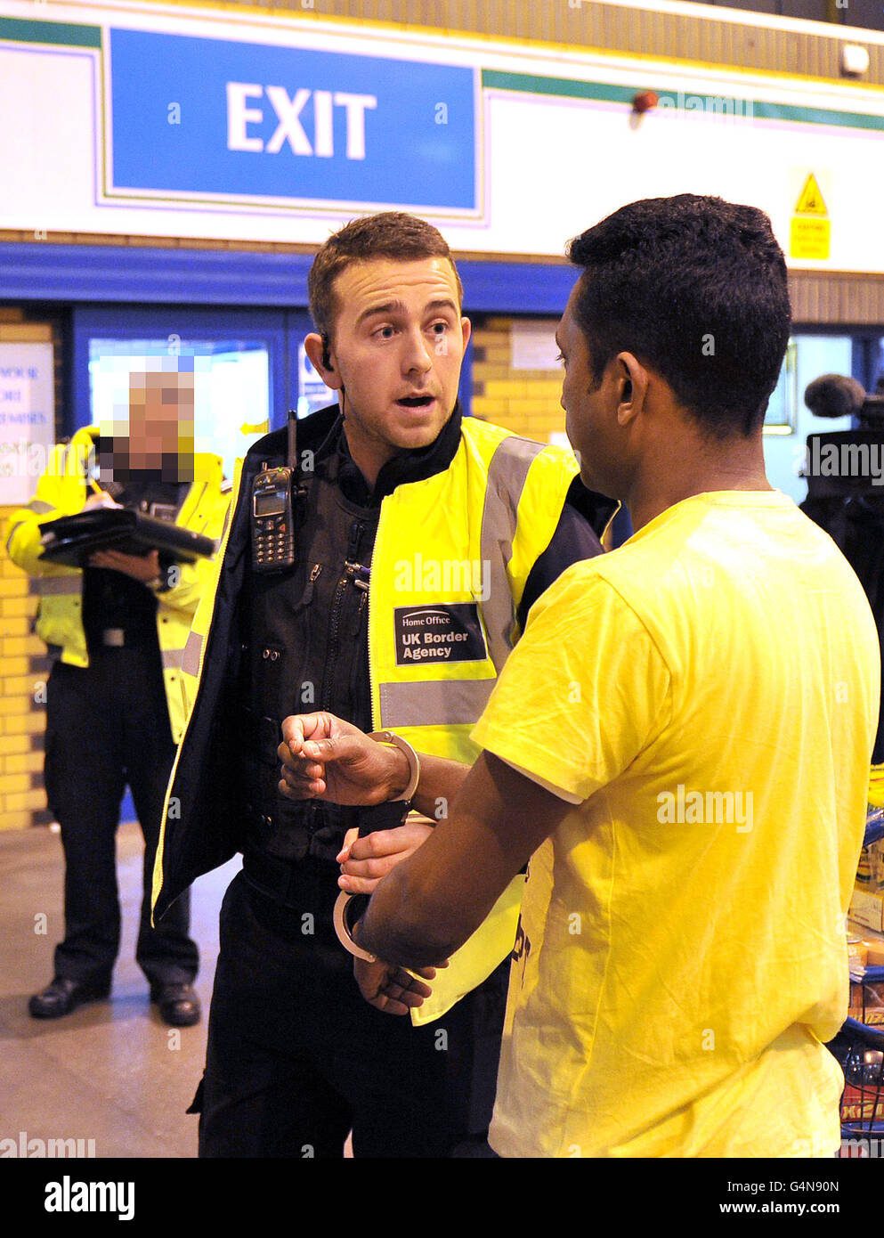 UK Border Agency raid Stock Photo - Alamy