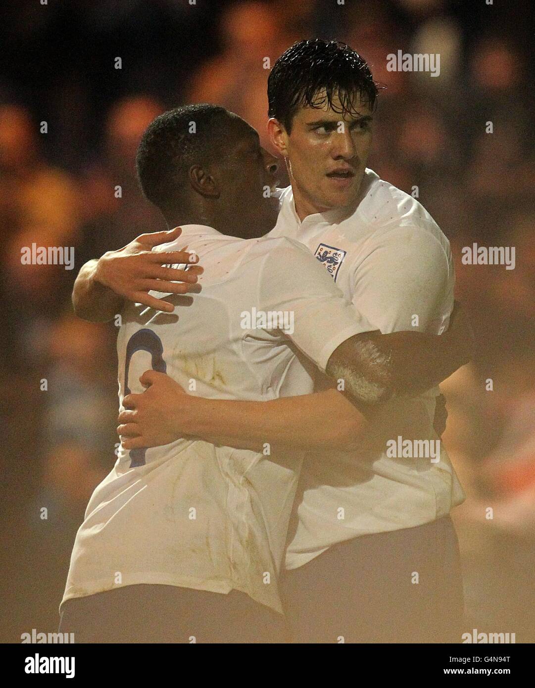 England's Martin Kelly (back) celebrates with his team-mate Marvin ...