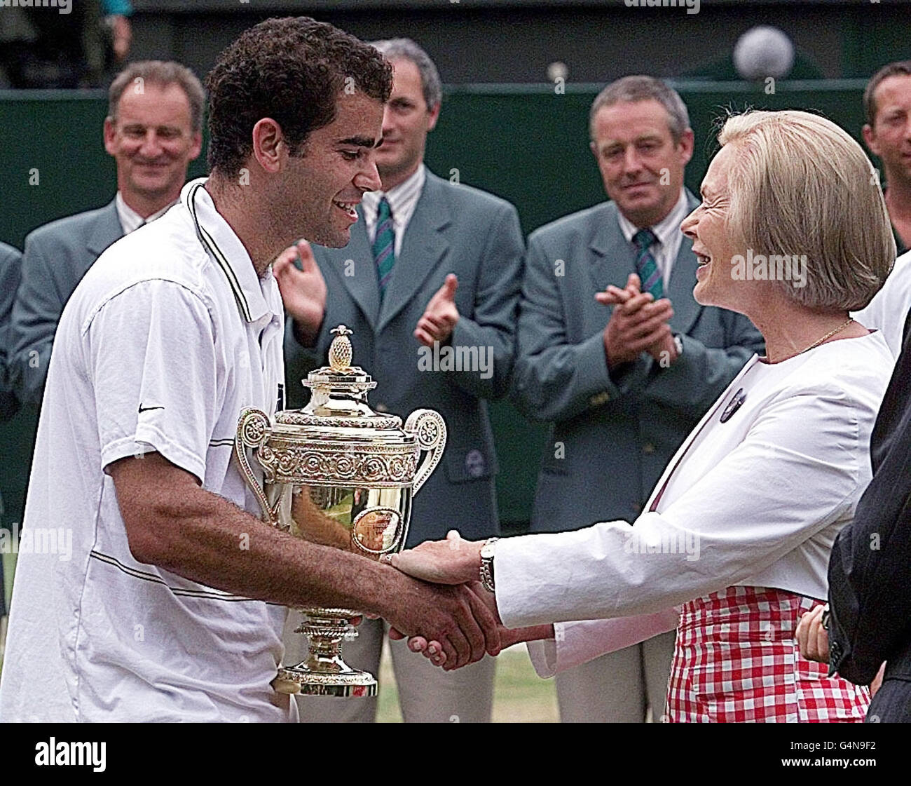 1 2 half length profile landscape trophy shaking hands smiling sport hi ...