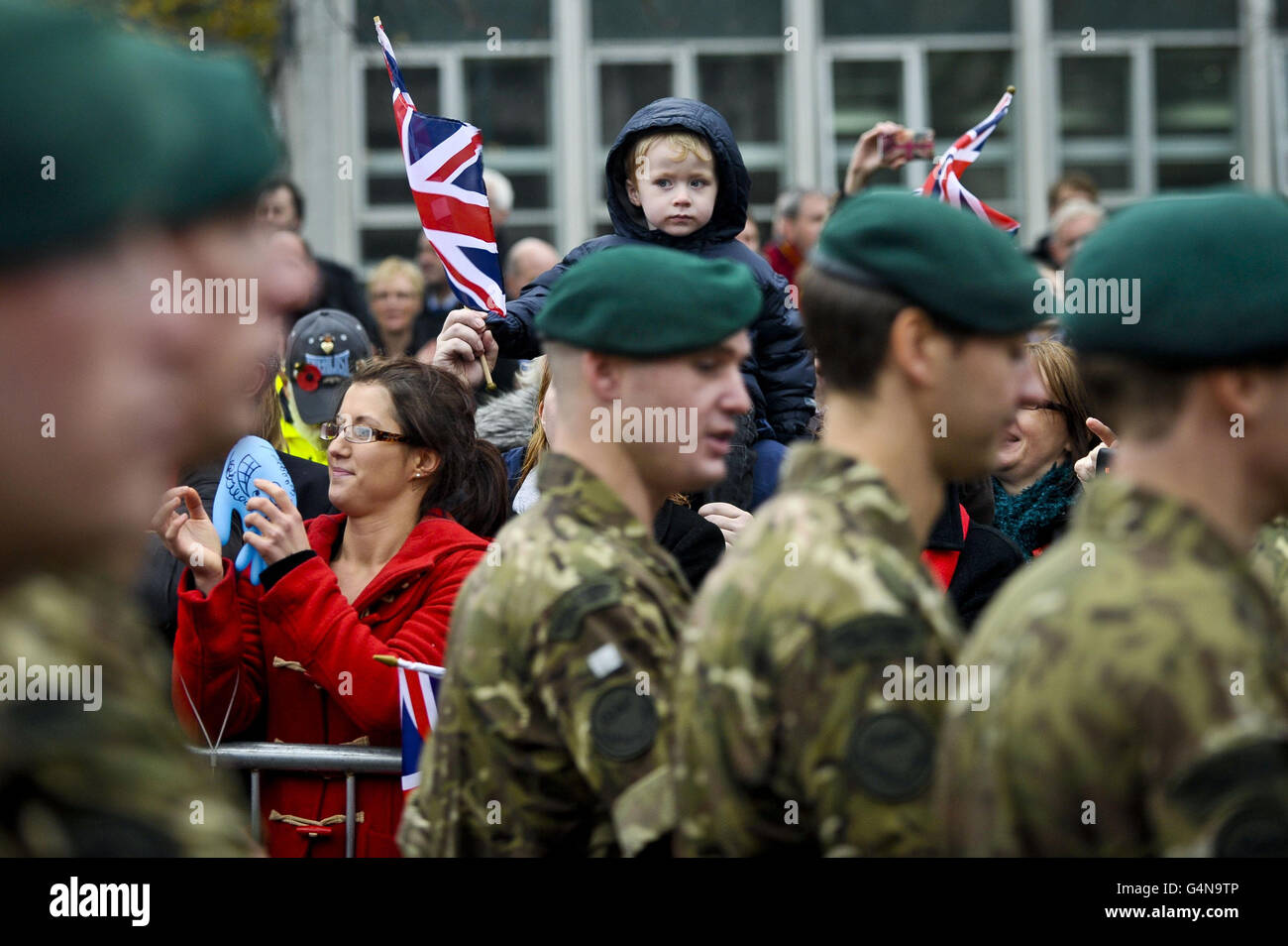 Commandos march past waving Union flags as they pass through Plymouth ...