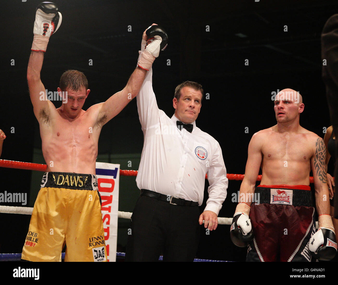 Lenny Daws (left) has his arm raised by referee Michael Alexanderafter ...