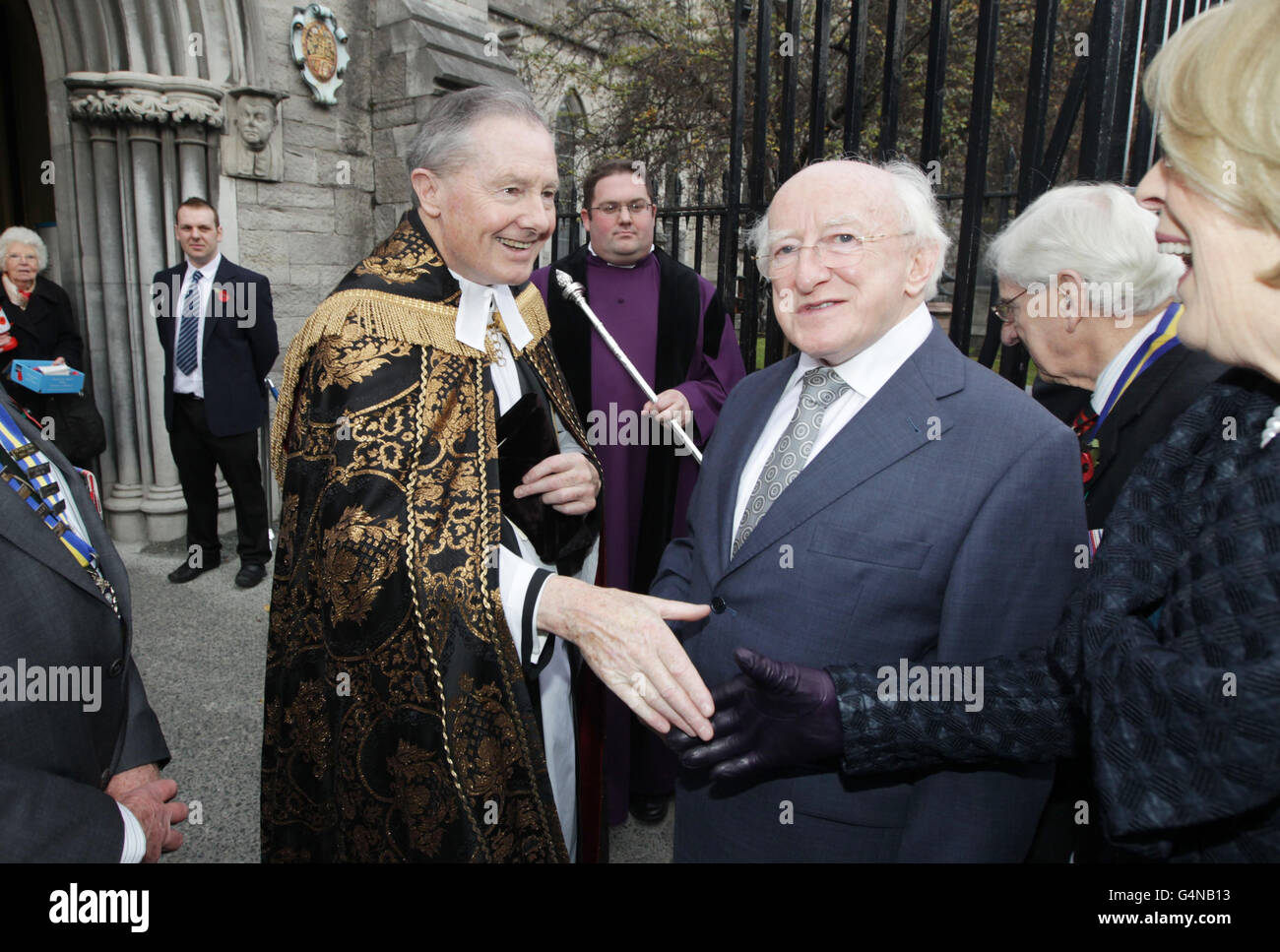 Irish President Michael D Higgins and his wife Sabina are greeted by ...