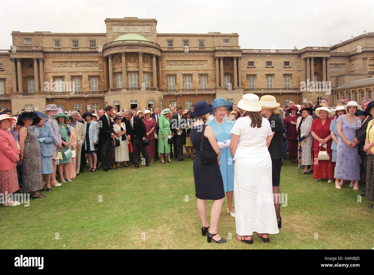 Queen/Garden Party. The Queen talks with guests at a Buckingham Palace ...