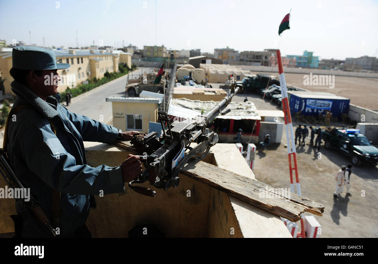 A member of the Afghan Uniform Police keeps a watch over the police ...