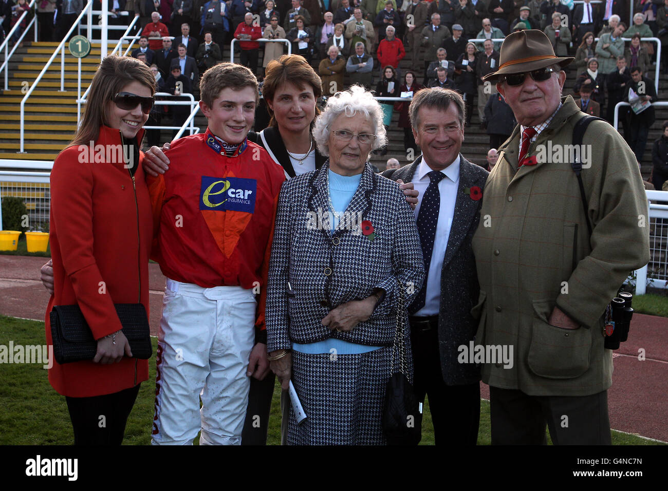 Jockey Harry Derham (2nd left) poses with friends and family including ...