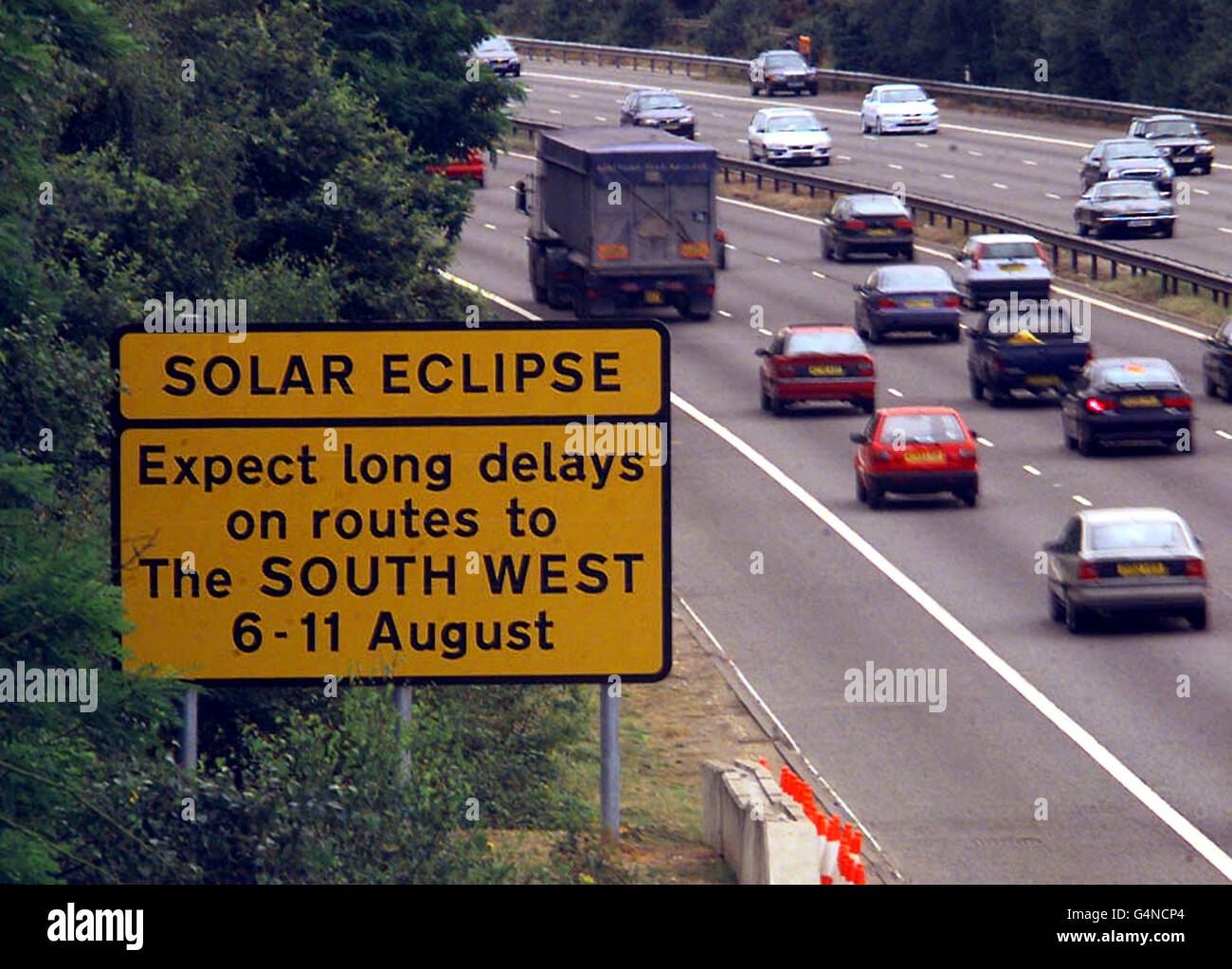 A recently-erected sign warns motorists on the M3 motorway, near London ...