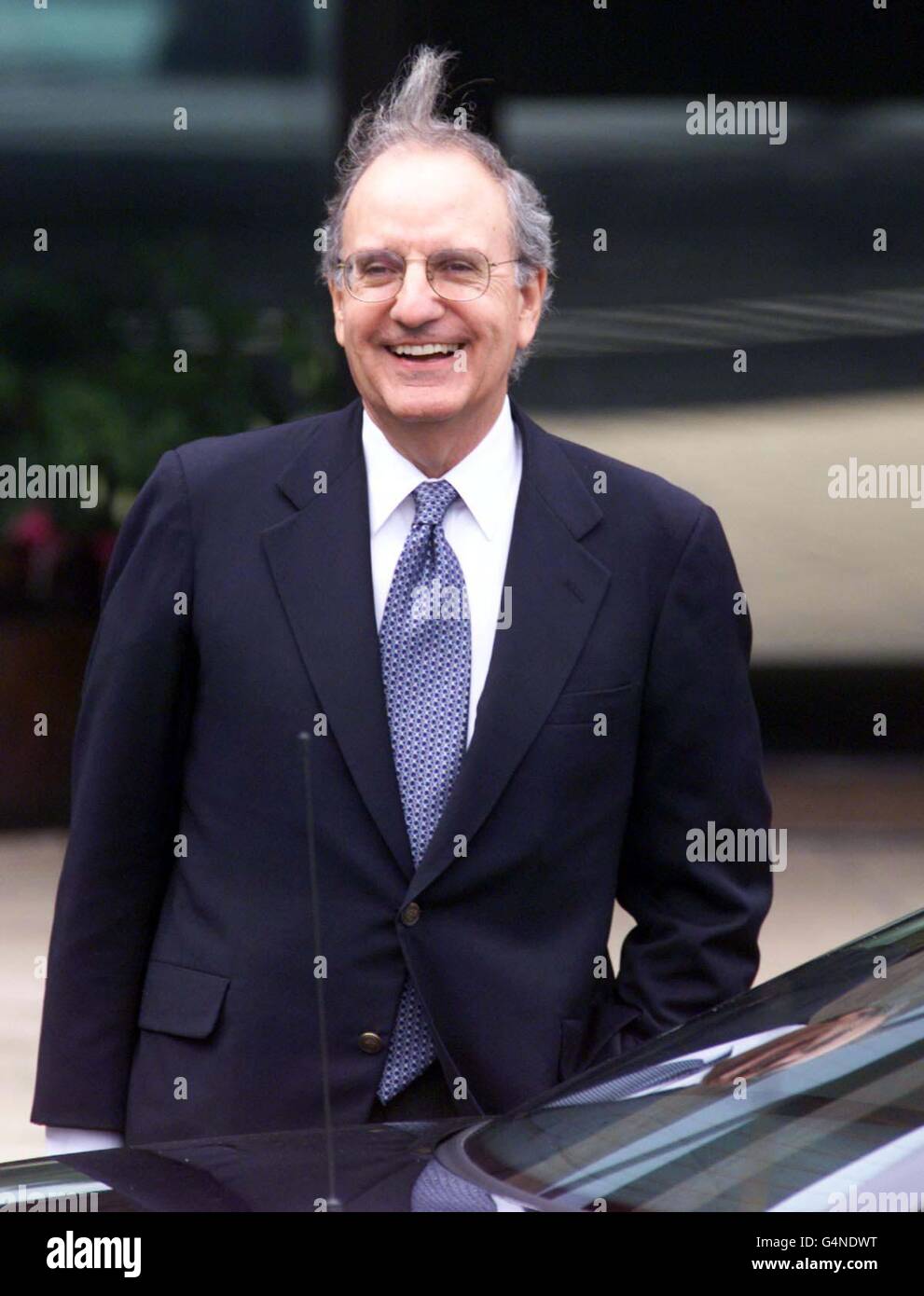 Talks Chairman, Senator George Mitchell smiles at waiting reporters ...