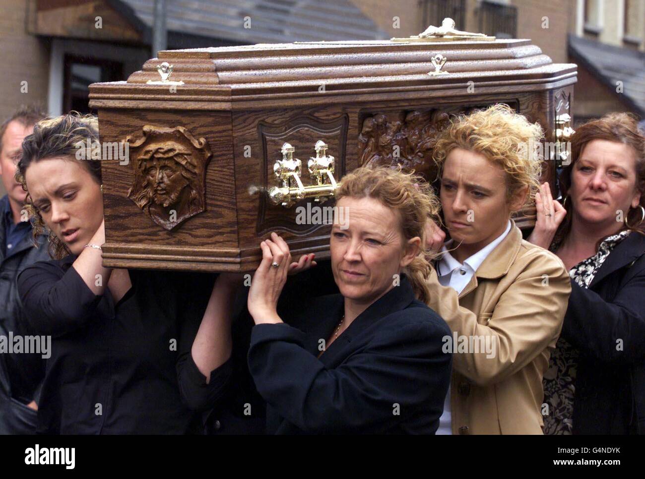 Pallbearers carry the coffin of Eamon Molloy from his family home in ...