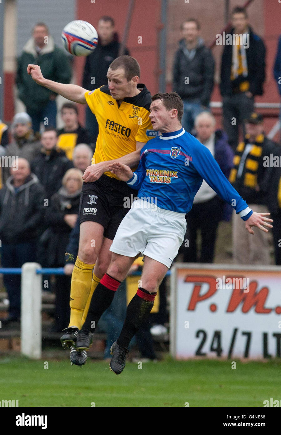 Livingston's Kenneth Deuchar (left) battles with Irvine's Zander Ryan ...