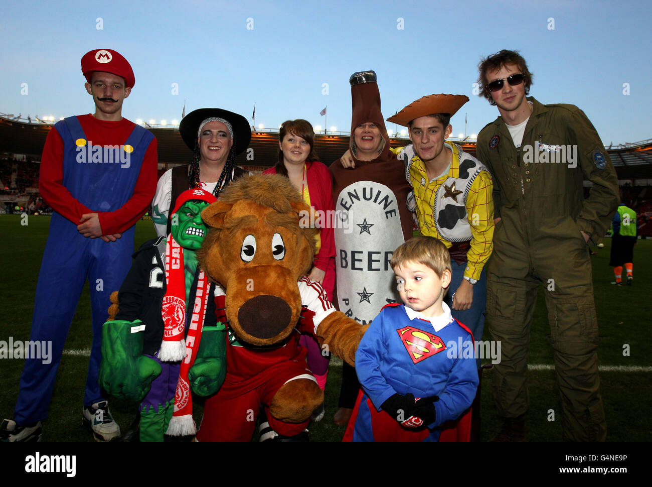 Fans in fancy dress at half time for the family football festival Stock ...