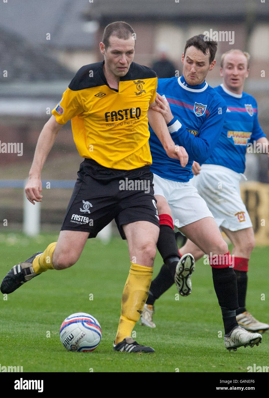 Livingston's Kenneth Deuchar (left) battles with Irvine's David McGeown ...