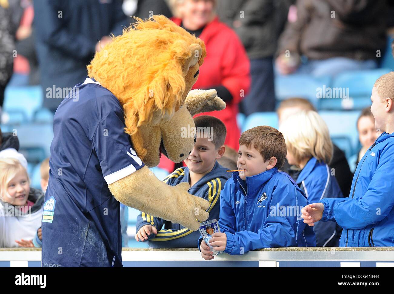 Zampa the lion interacts with young fans at half time hi-res stock ...
