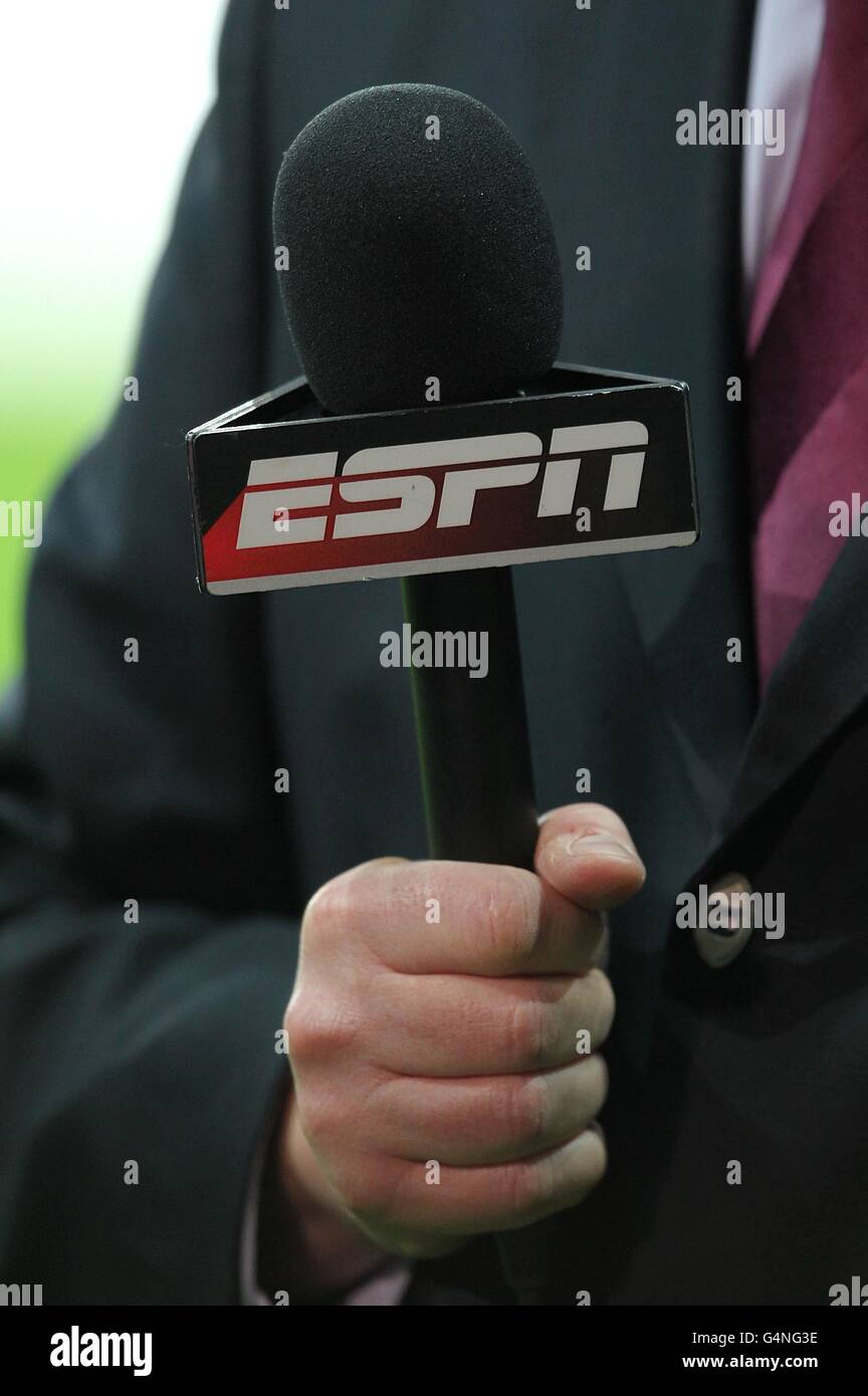 Detail of an espn commentator holding microphone the game hi-res stock ...