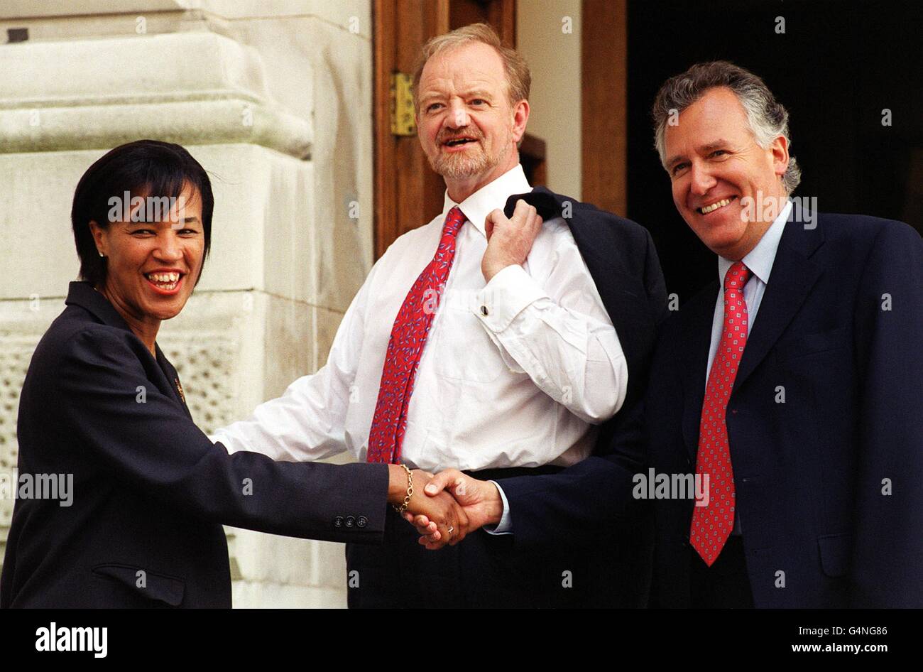Foreign Secretary, Mr Robin Cook, flanked by Baroness Scotland and her ...