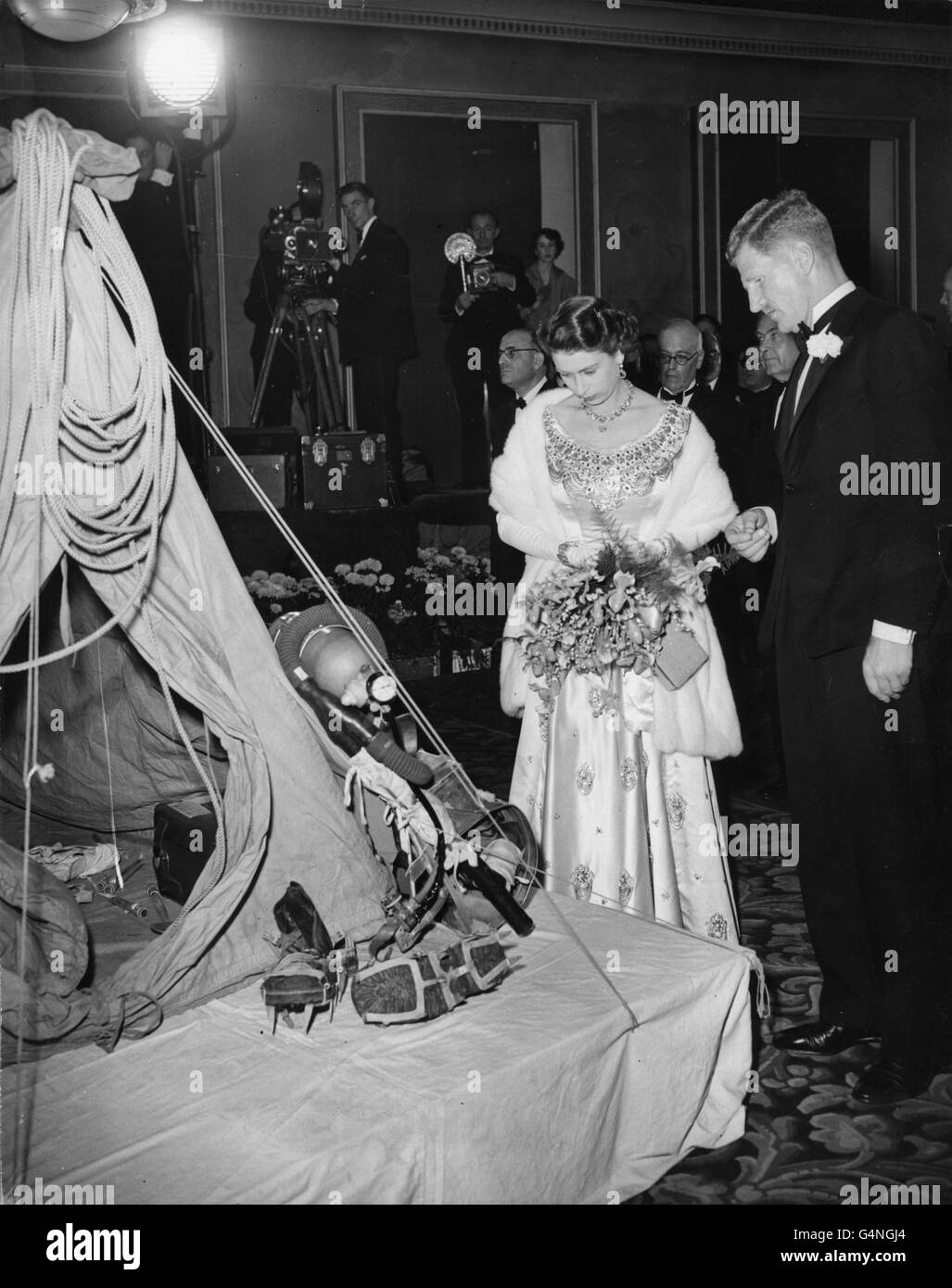 Queen Elizabeth II looking at equipment used by the British conquest of ...