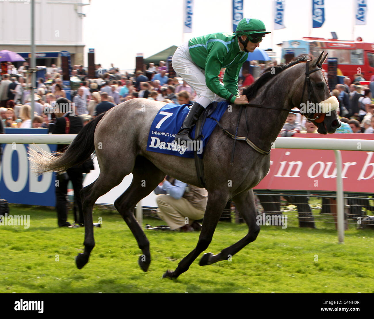 Laughing Lashes ridden by jockey Fran Berry goes to post in the Darley ...